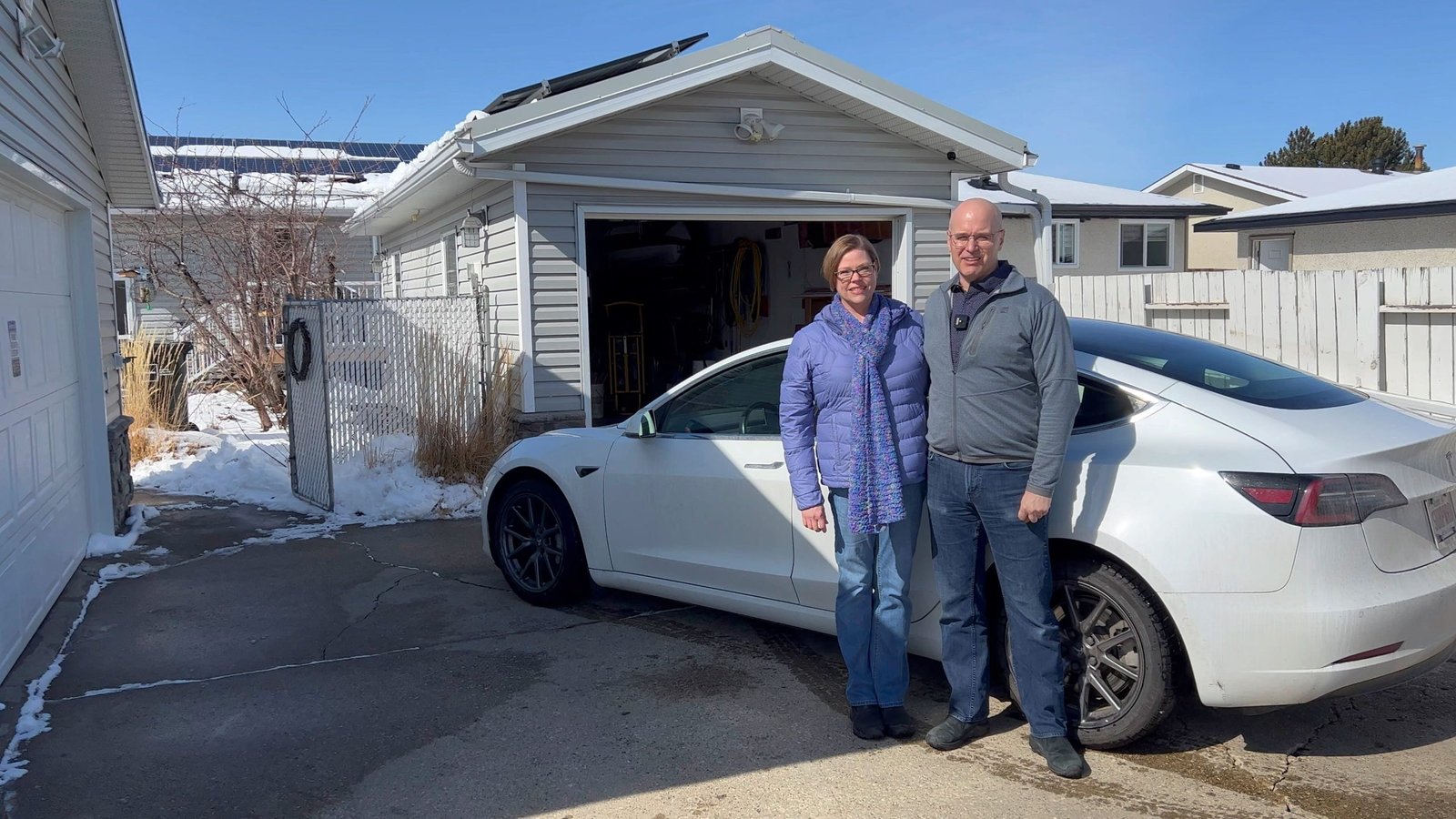 Darcy and Darren with their Tesla Model 3 electric car. - Green Energy ...